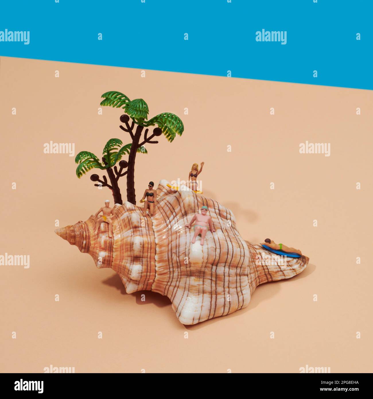 some miniature people, wearing swimsuit, relaxing on a sea shell, next ...