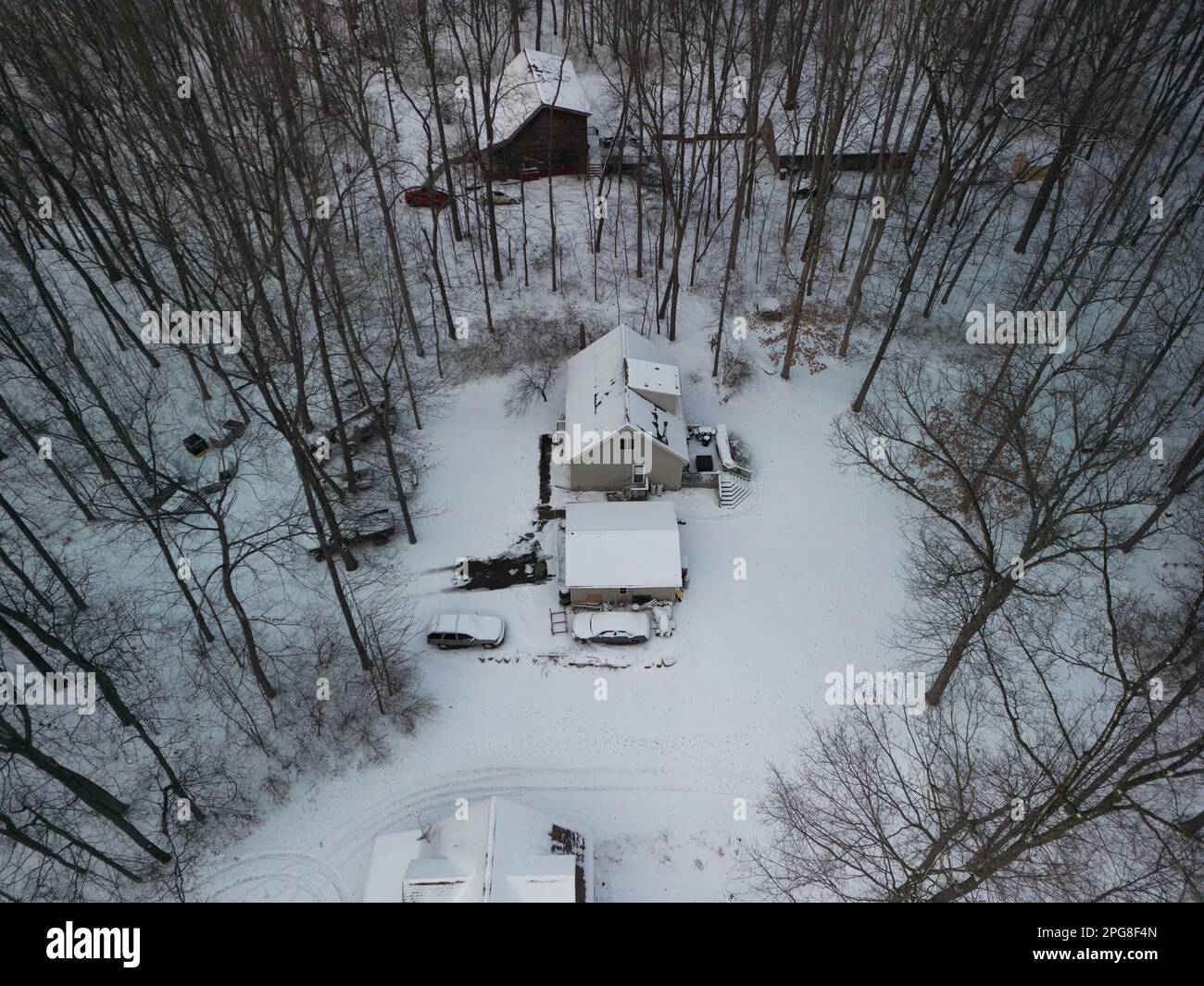 This image features two houses set against a backdrop of snow-covered ...