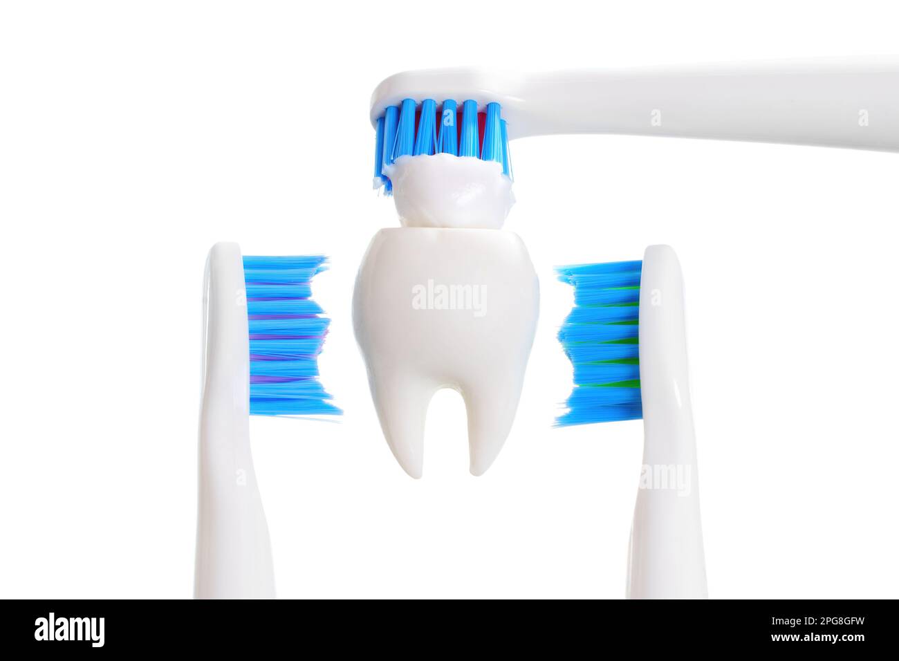 Close-up view of an electric toothbrush applying toothpaste to a tooth ...