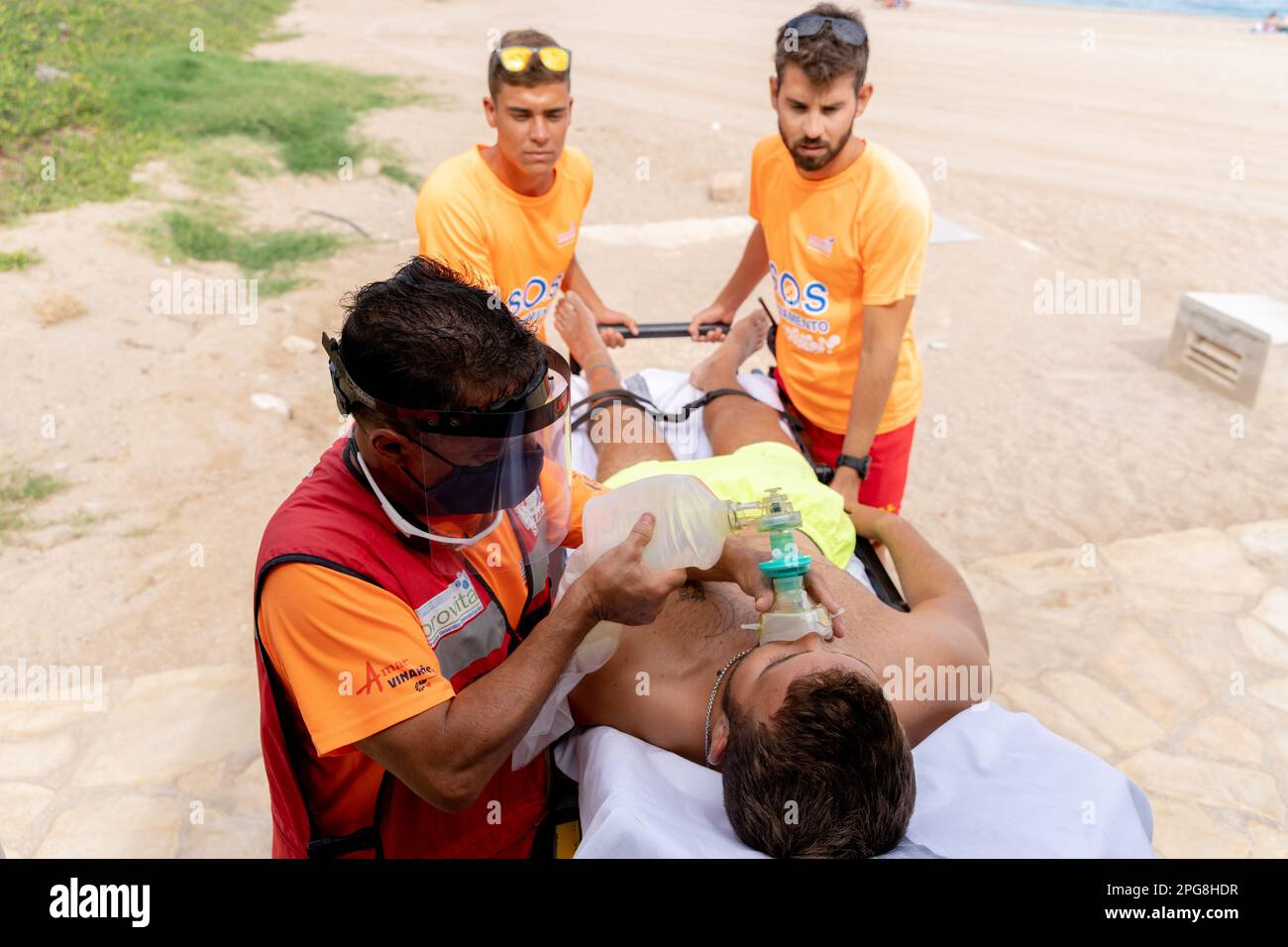 Close up photo with high angle of lifeguards oxygenating a patient on ...