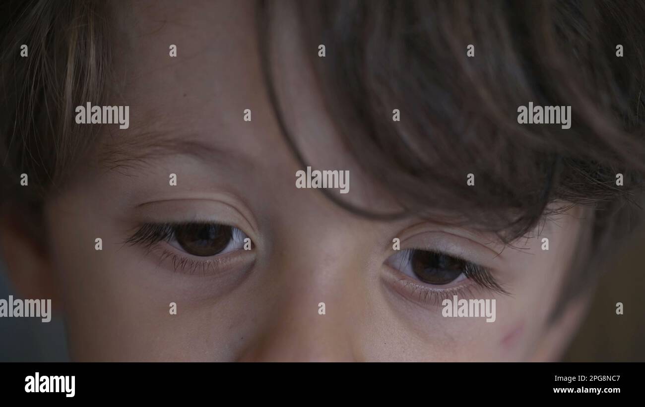 Small boy macro close up eyes and face. Child looking at camera ...