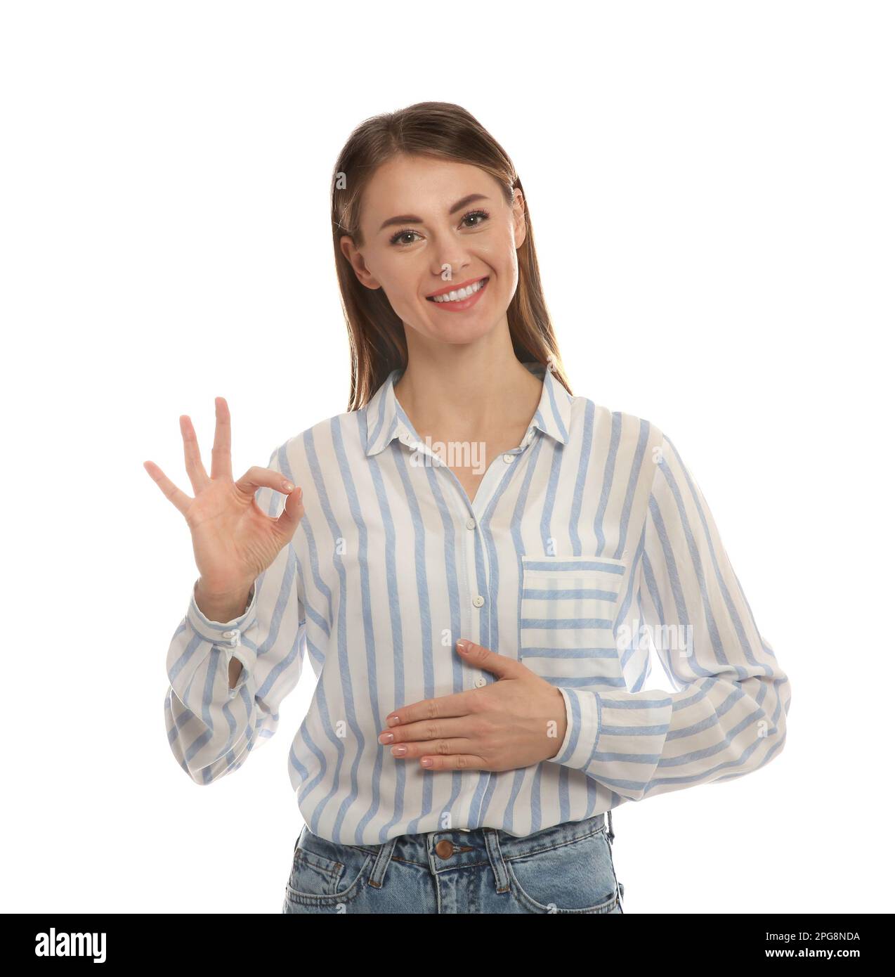 Healthy woman holding hand on belly and showing OK gesture against ...