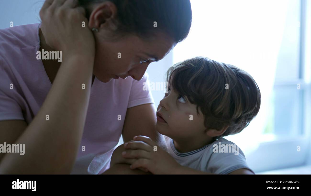 Mother educating child misbehavior. Small boy feeling guilty emotion leaning on mom. Parent ...