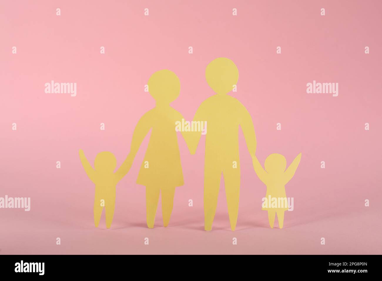 Paper family figure on pink background. Child adoption concept Stock ...