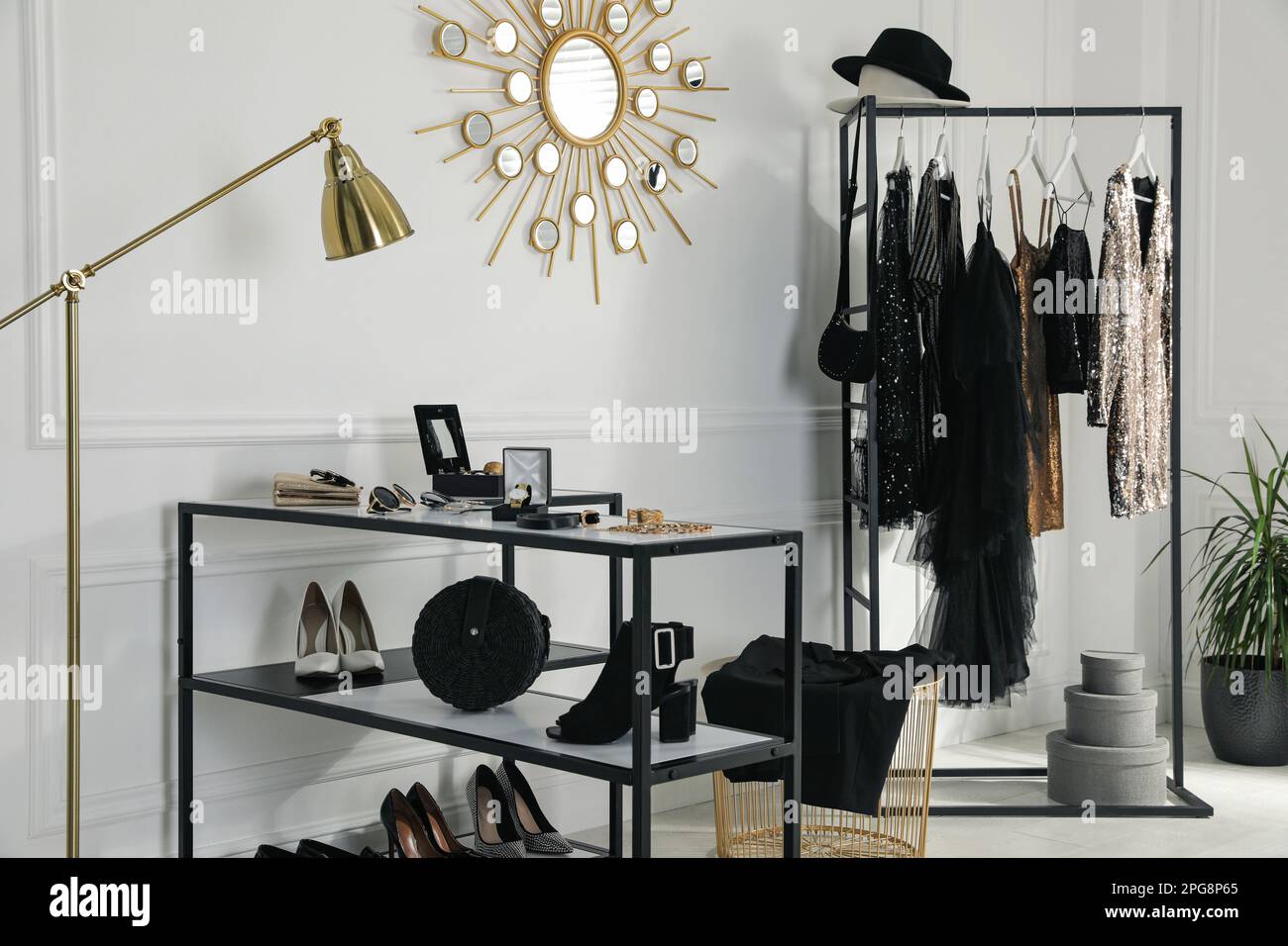 Stylish dressing room interior with trendy clothes and luxury ...