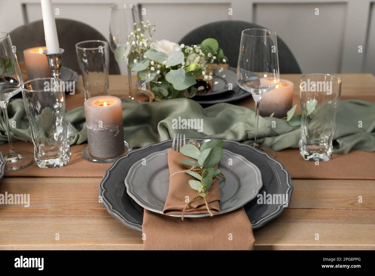 Festive table setting with beautiful floral decor indoors Stock Photo ...
