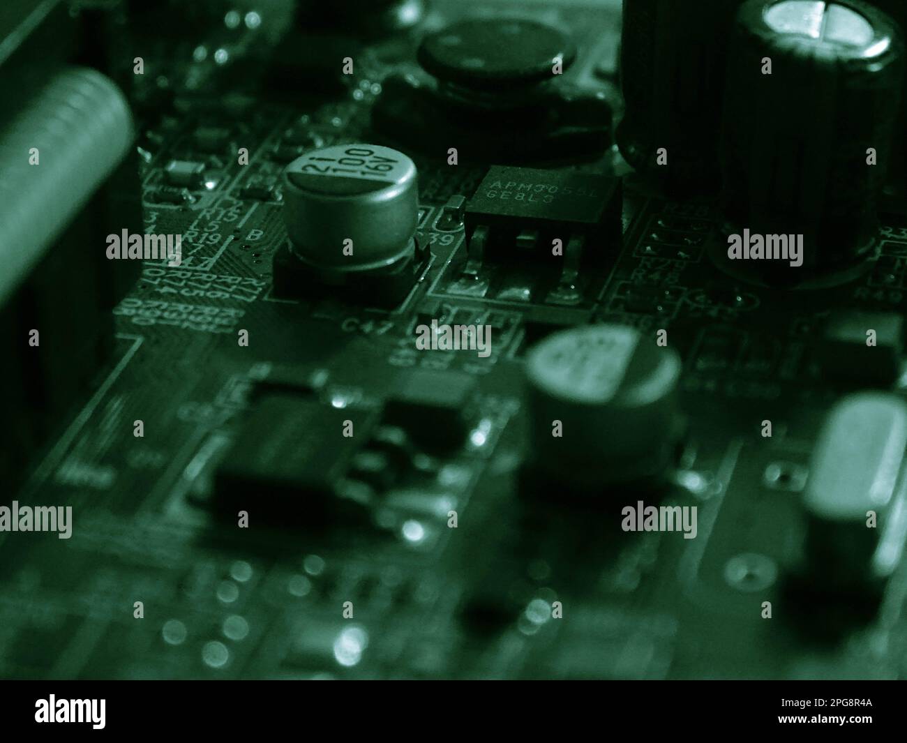 A close-up view of a complex electronic circuit board, displaying a ...