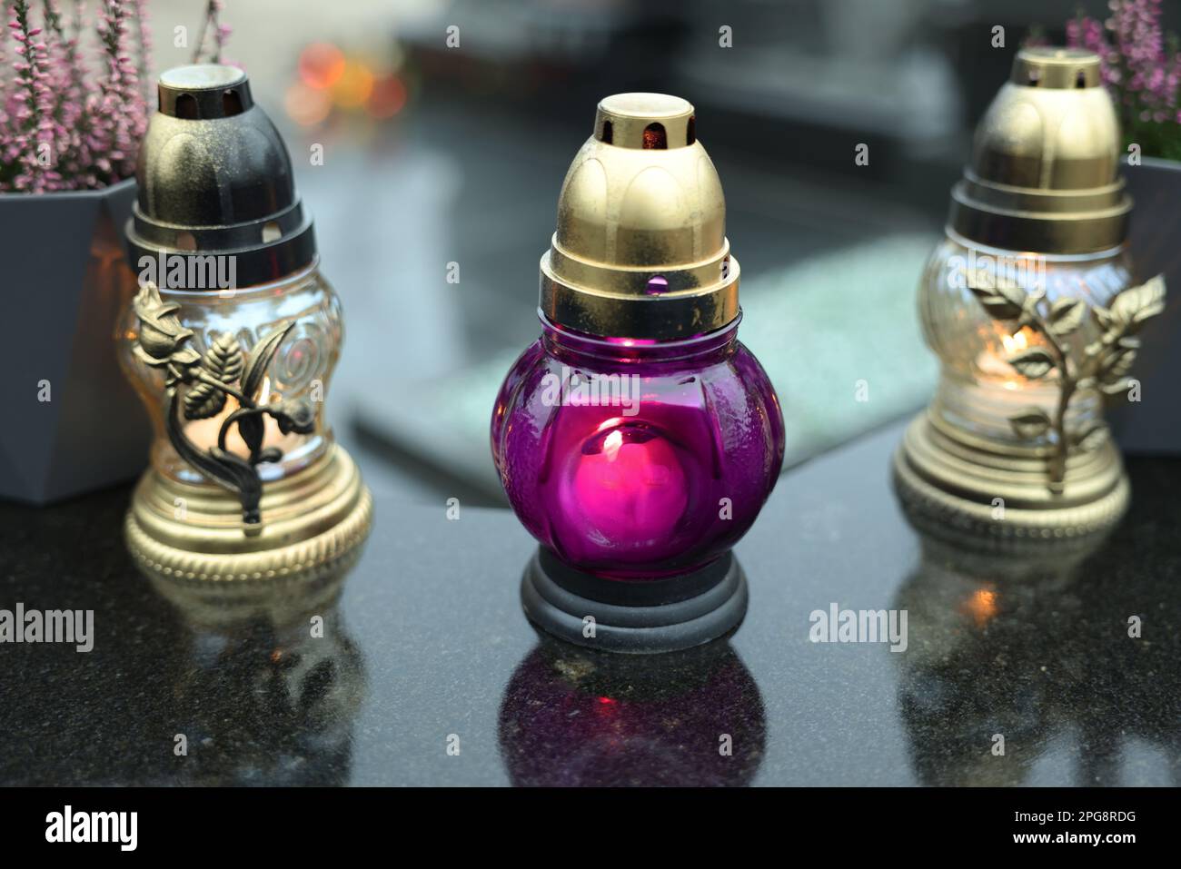 Grave lights on granite surface at cemetery Stock Photo - Alamy