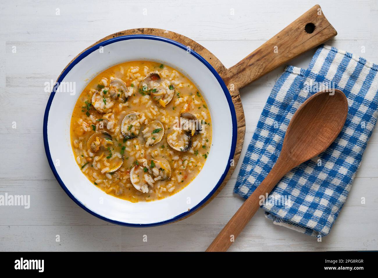 Rice soup with clams. Traditional Spanish recipe Stock Photo - Alamy