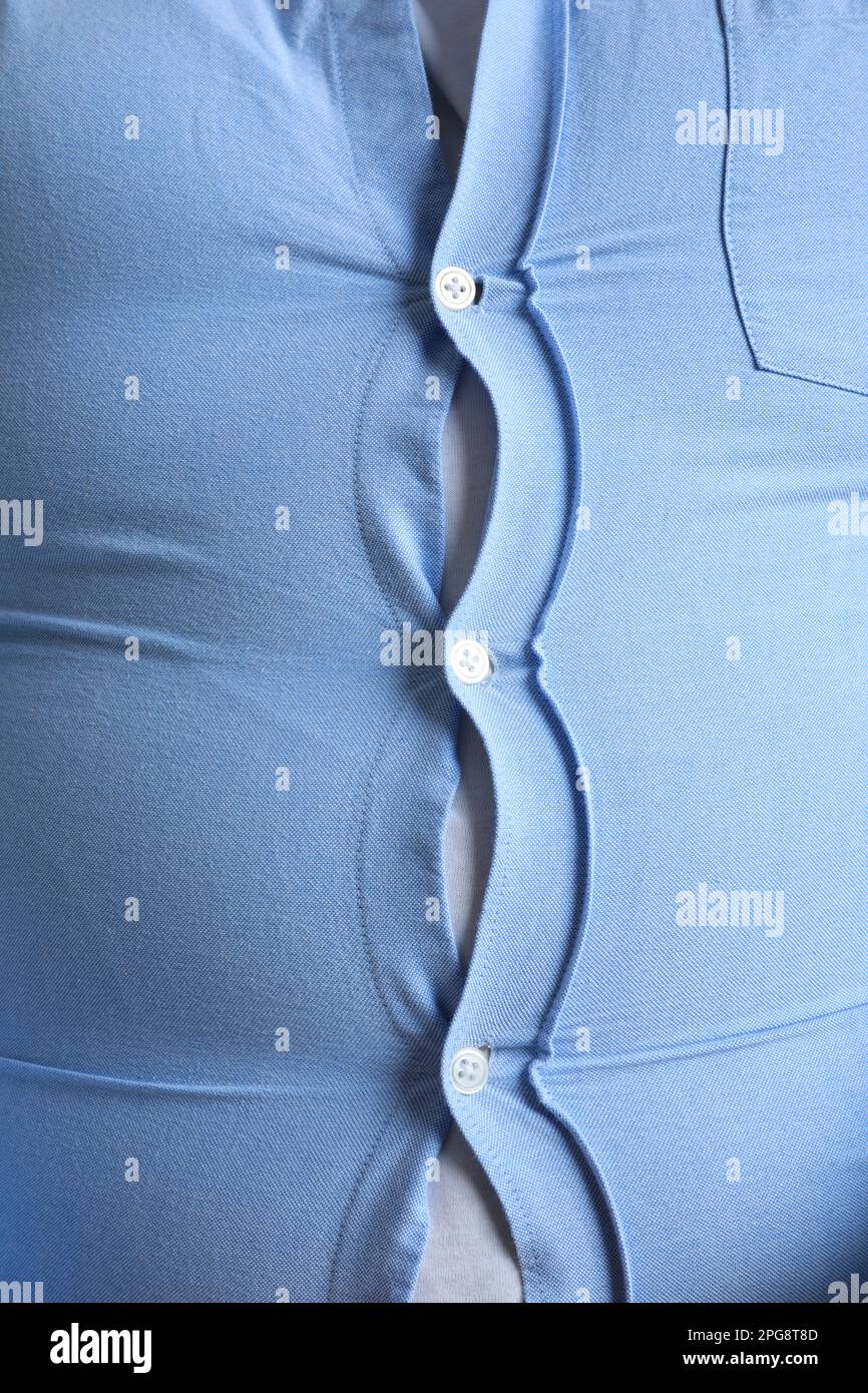 Closeup view of overweight man in tight shirt as background Stock Photo ...