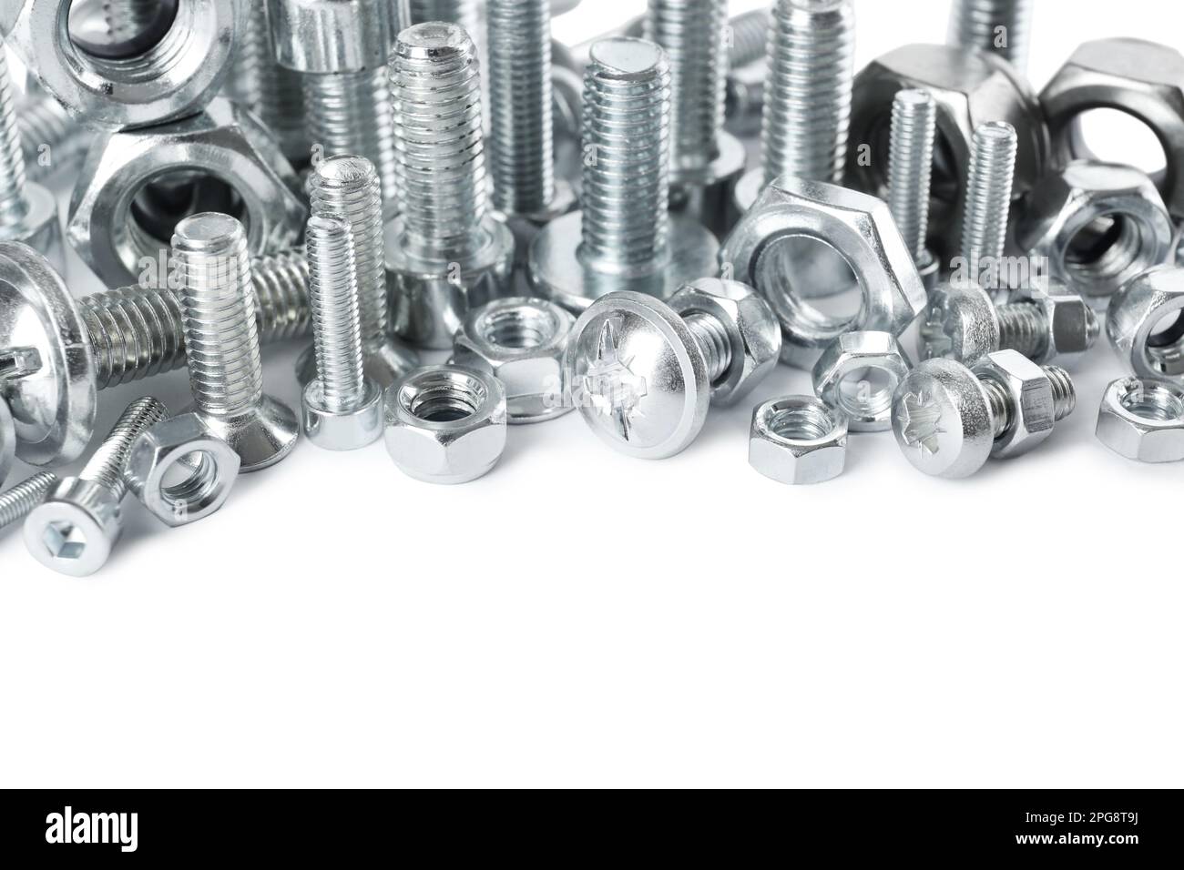 Different metal bolts and nuts on white background Stock Photo - Alamy