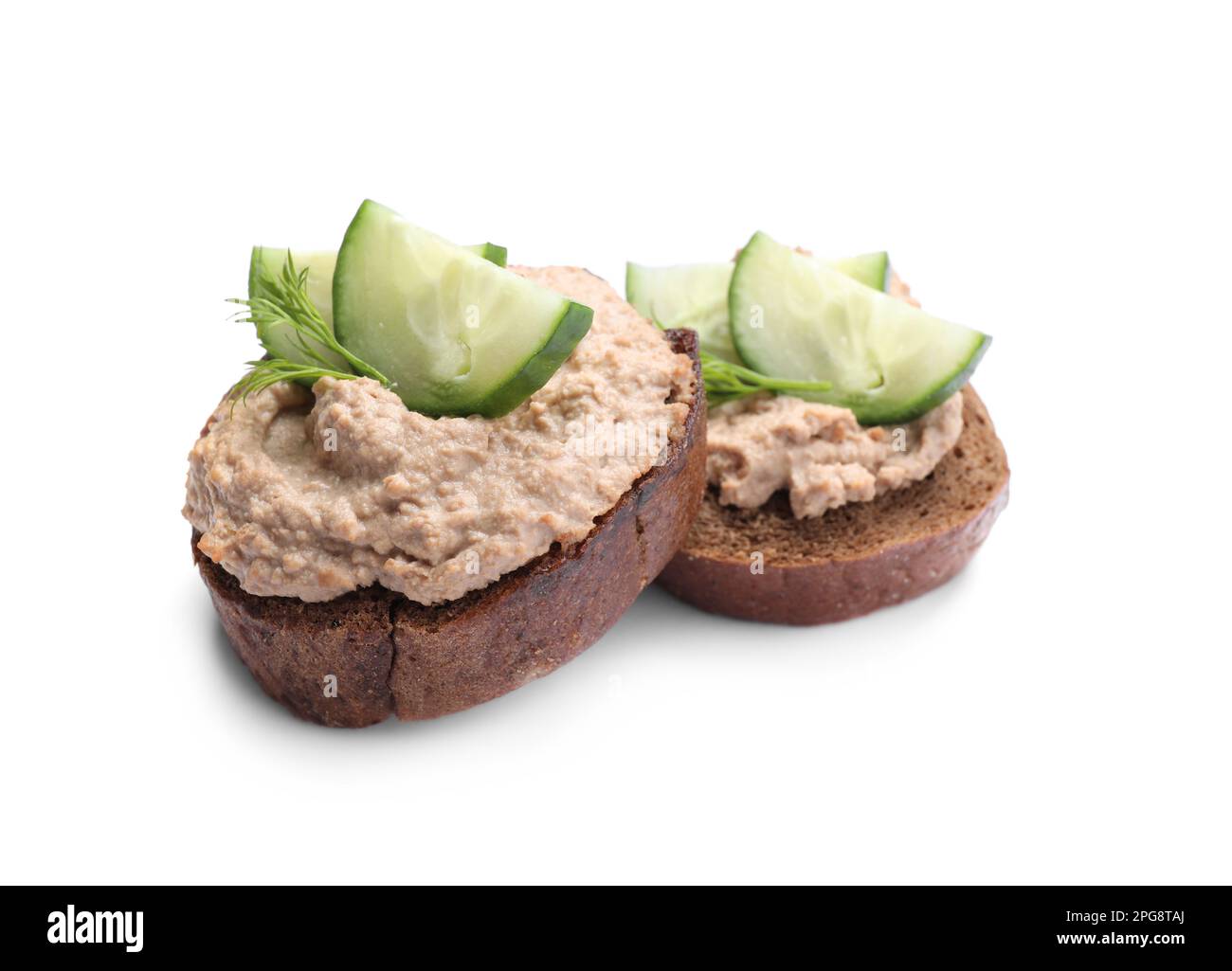 Slices of bread with delicious pate, cucumber and dill on white ...
