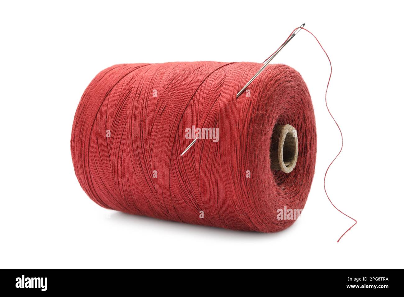 Red sewing thread with needle on white background Stock Photo - Alamy