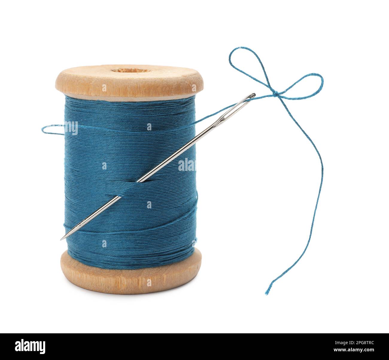 Light blue sewing thread with needle on white background Stock Photo ...