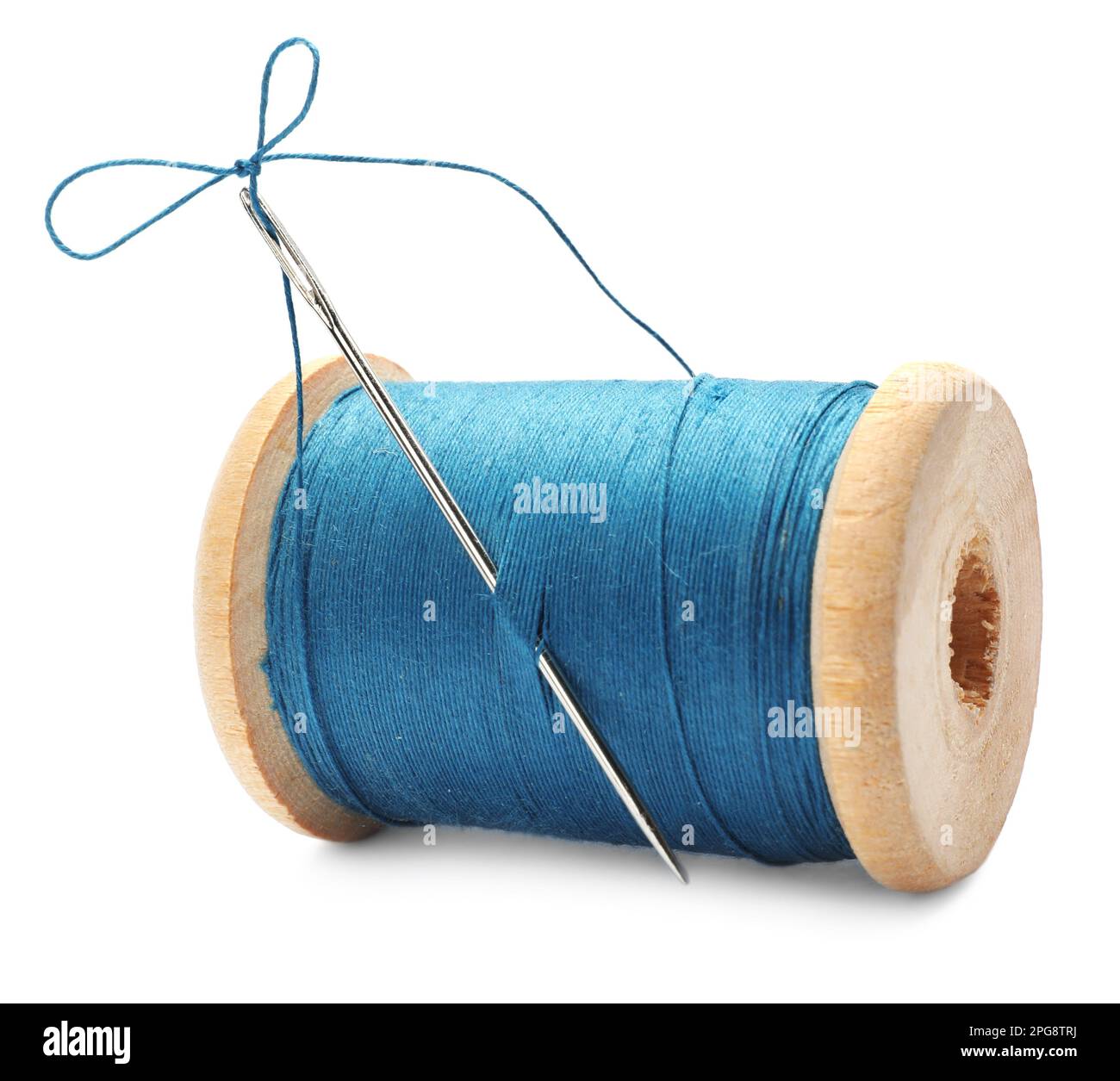 Light blue sewing thread with needle on white background Stock Photo ...