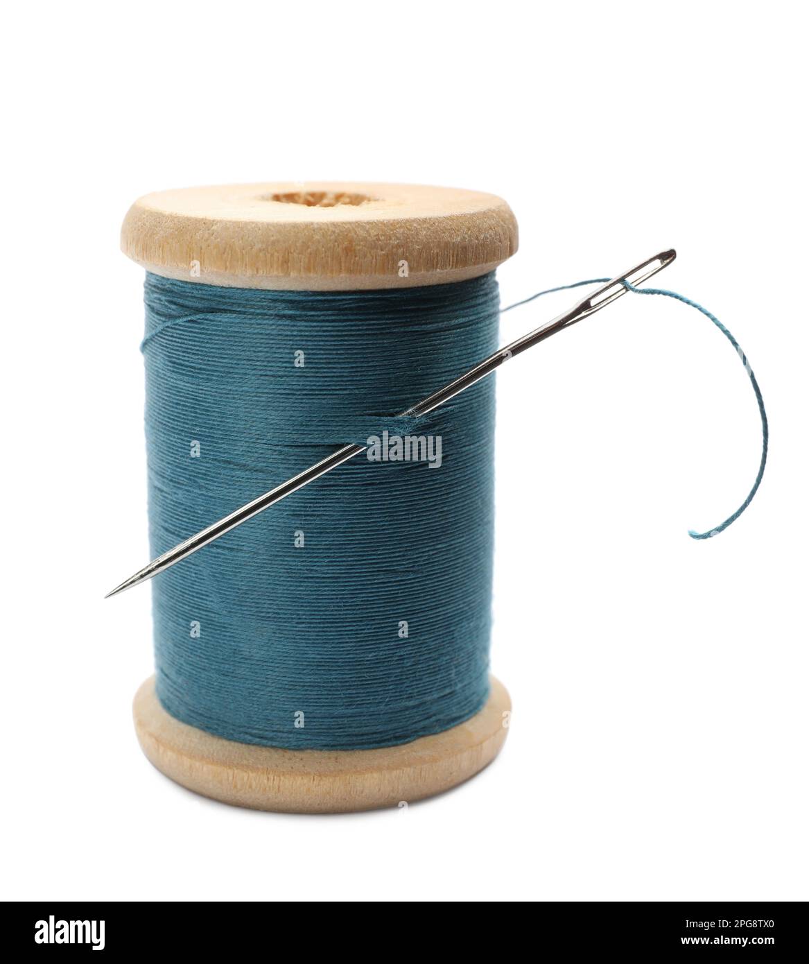 Light blue sewing thread with needle on white background Stock Photo ...