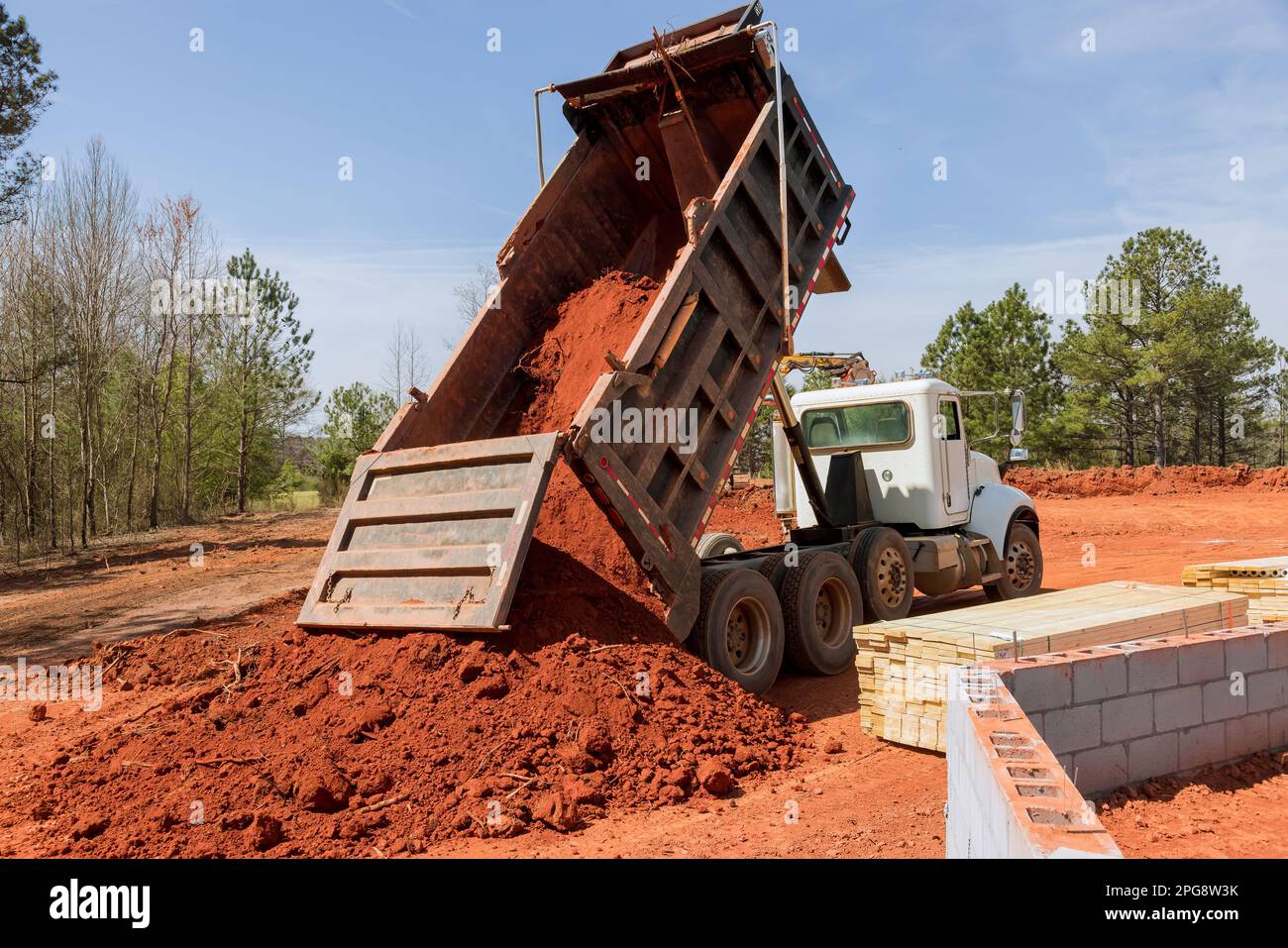 Dump Truck Dumping Dirt
