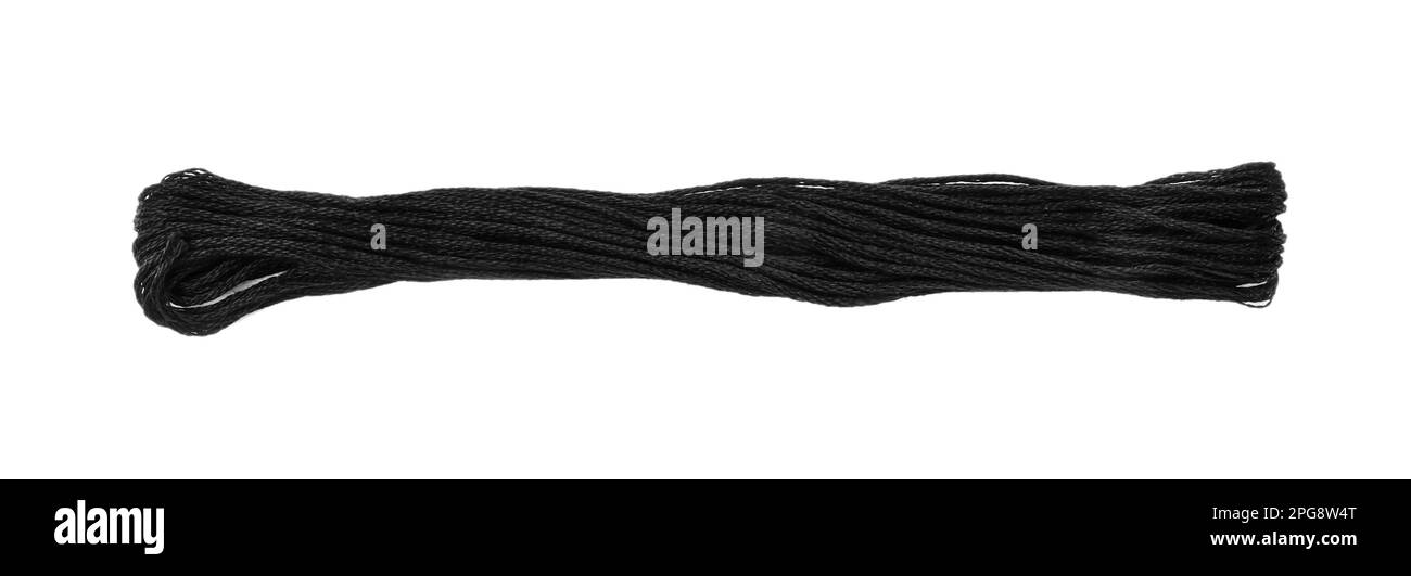 Bright black embroidery thread on white background Stock Photo - Alamy