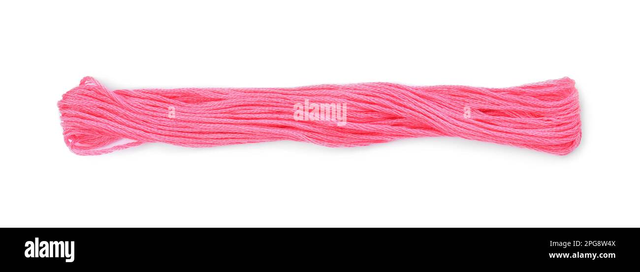 Bright pink embroidery thread on white background Stock Photo - Alamy