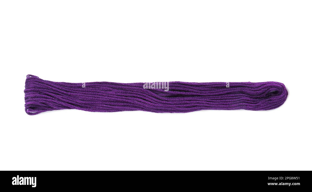 Bright purple embroidery thread on white background Stock Photo - Alamy