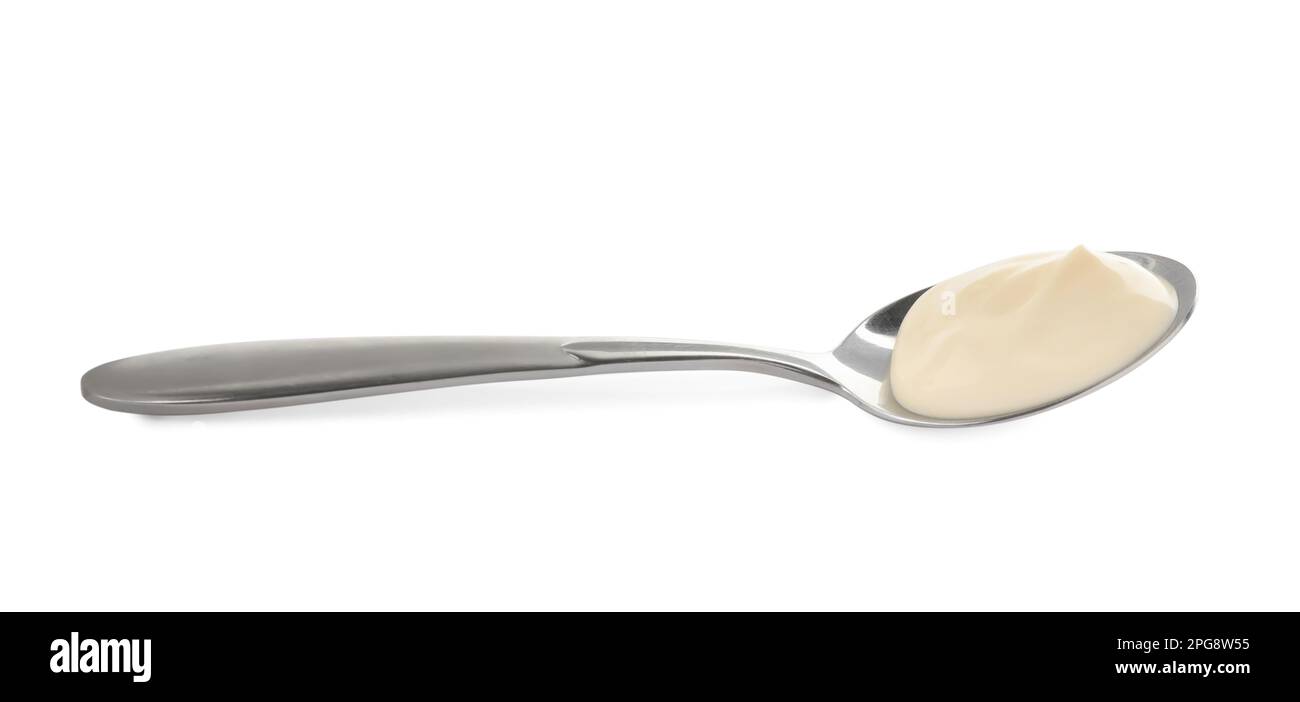 Metal spoon with mayonnaise isolated on white Stock Photo - Alamy