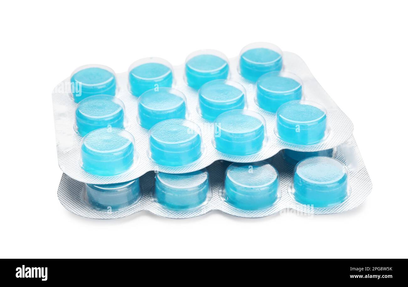 Blisters with blue cough drops on white background Stock Photo - Alamy