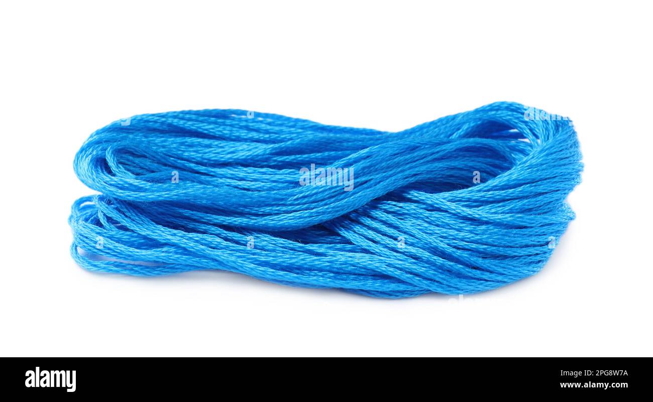 Light blue embroidery thread on white background Stock Photo - Alamy