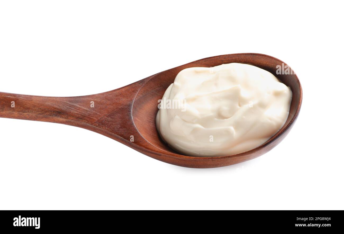Wooden spoon with tasty mayonnaise isolated on white Stock Photo - Alamy