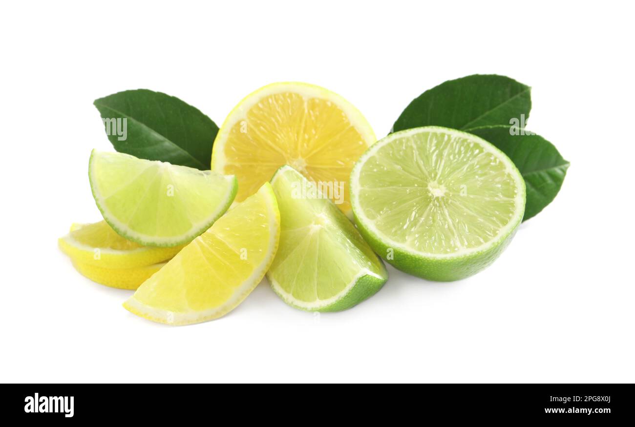 Cut fresh ripe lemon, lime and green leaves on white background Stock ...