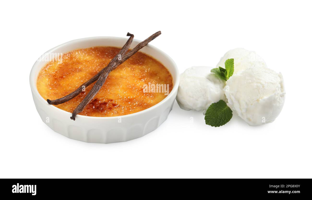Delicious creme brulee with vanilla sticks, scoops of ice cream and ...