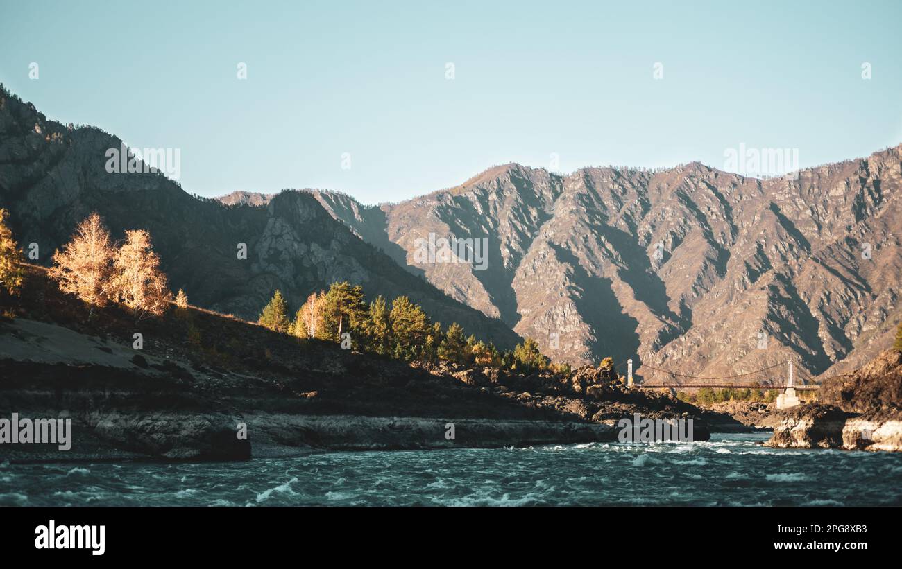Oroktoysky bridge across the fast mountain river Katun in the shade ...