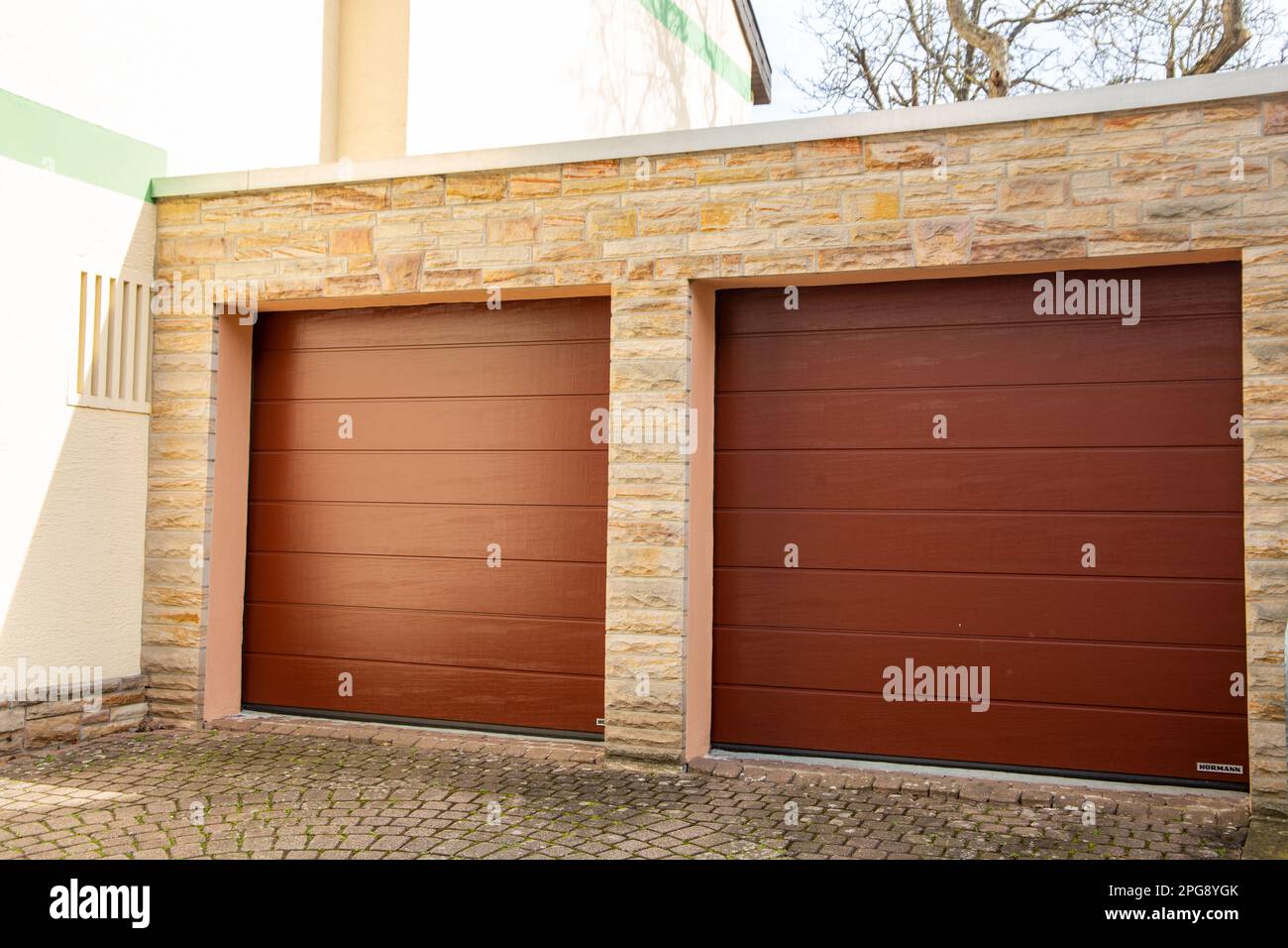 Two red sectional doors from the german manufacturer Hörmann on the ...