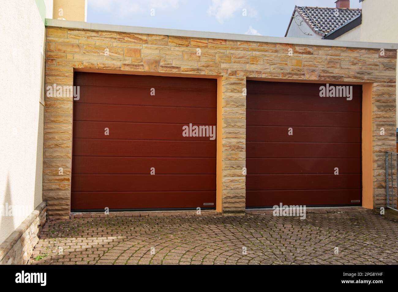 Two red sectional doors from the german manufacturer Hörmann on the ...