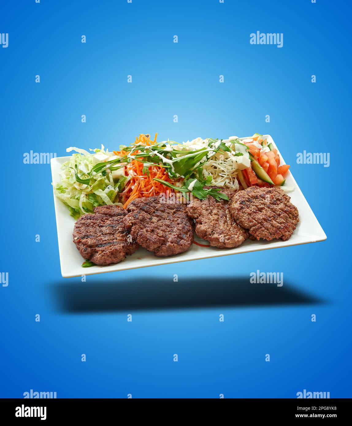 Floating Indian Kabab on white plate on blue gradient background Stock ...