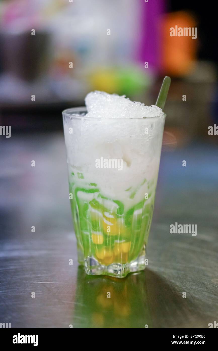A cup of Lod Chong on the table with blurred background. It is a Thai ...