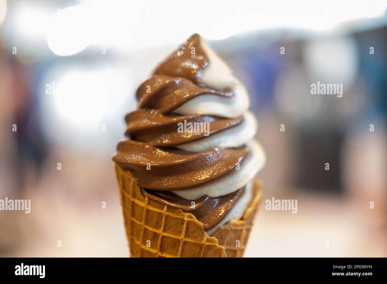 Vanilla and Chocolate Ice cream with waffle cone. blur background Stock ...
