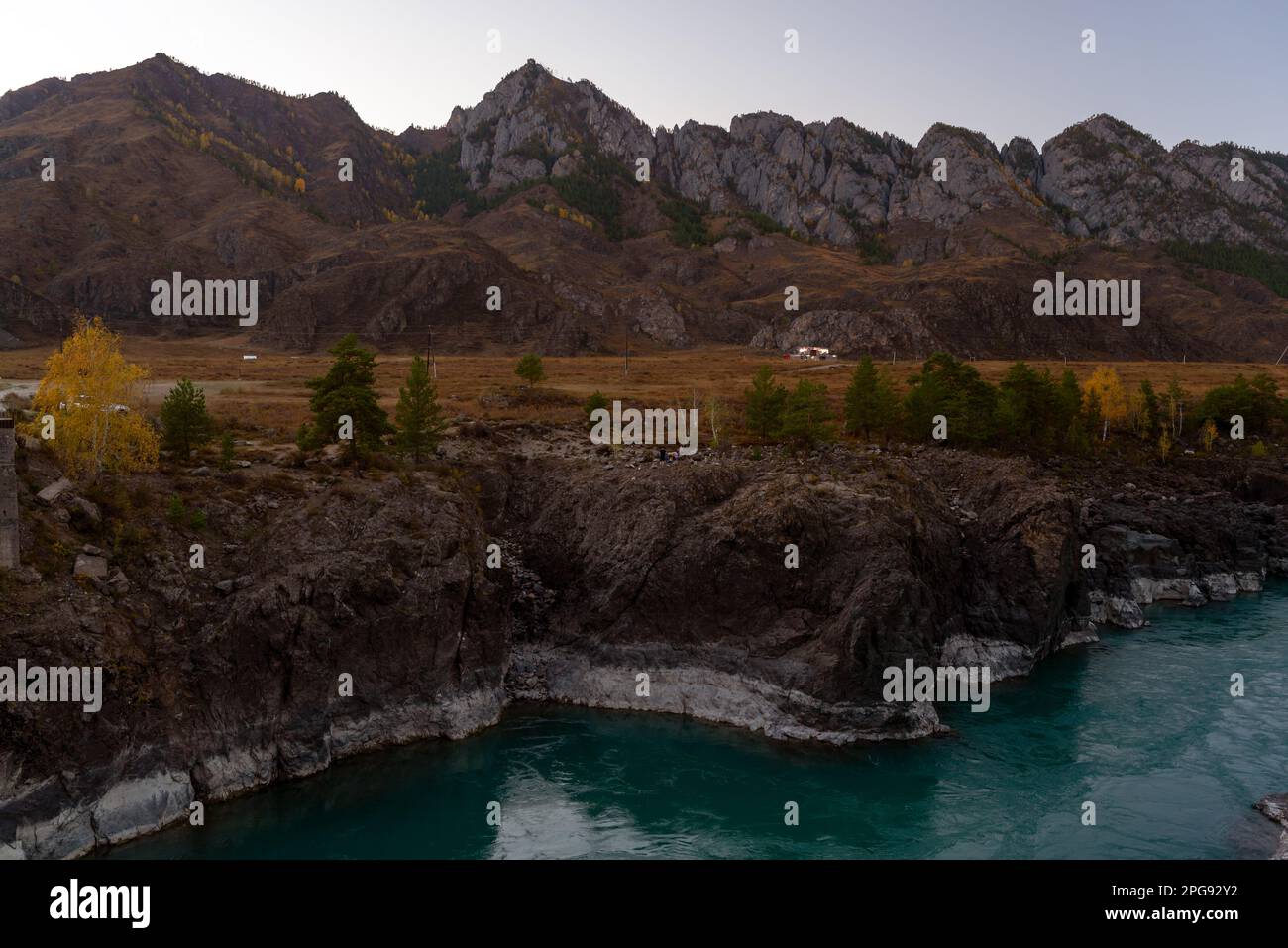 Rocky shores of black stone of volcanic rock in a narrow place with ...