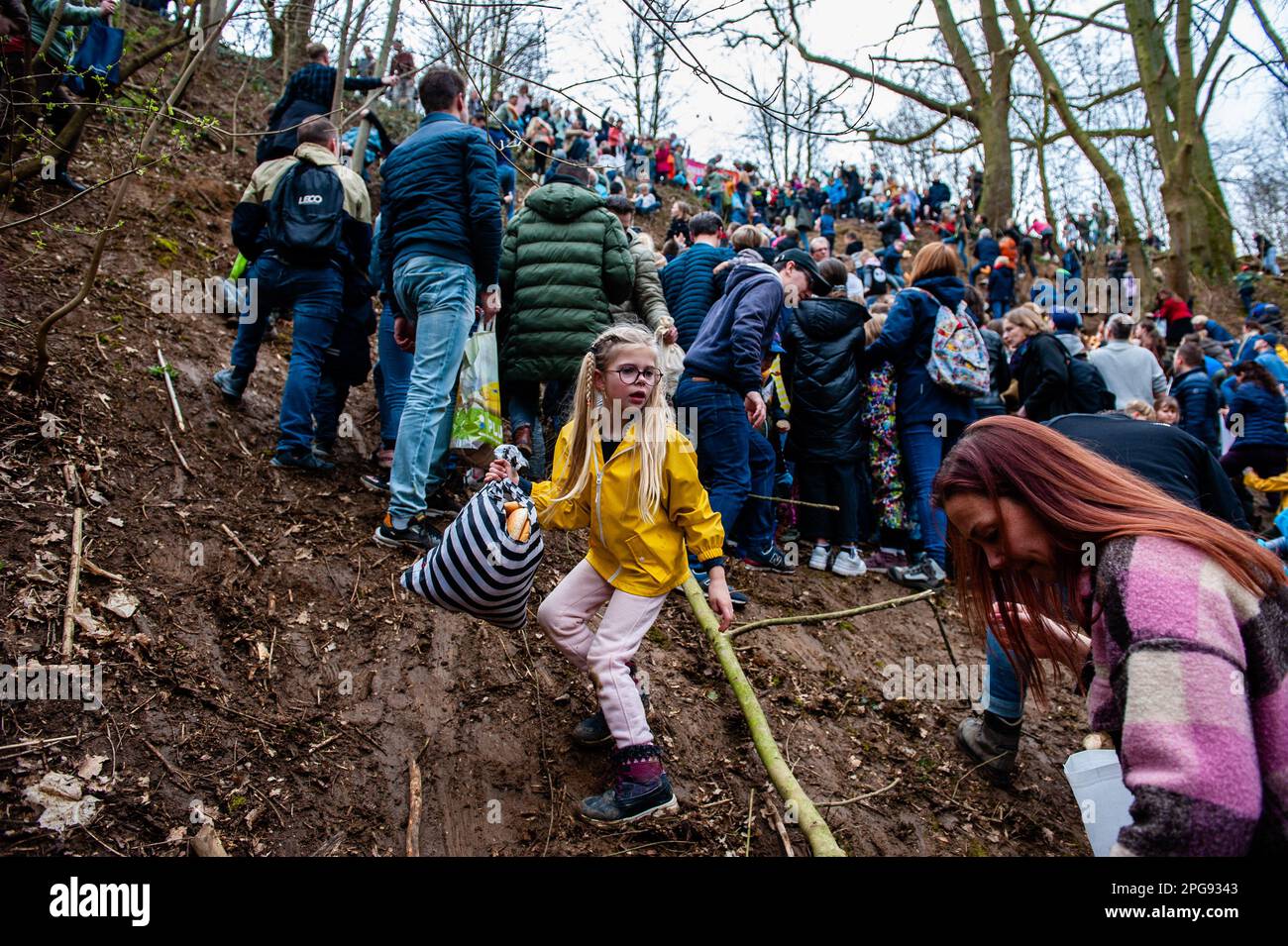 A girl is seen trying not to slipper in the mud. Every year halfway ...