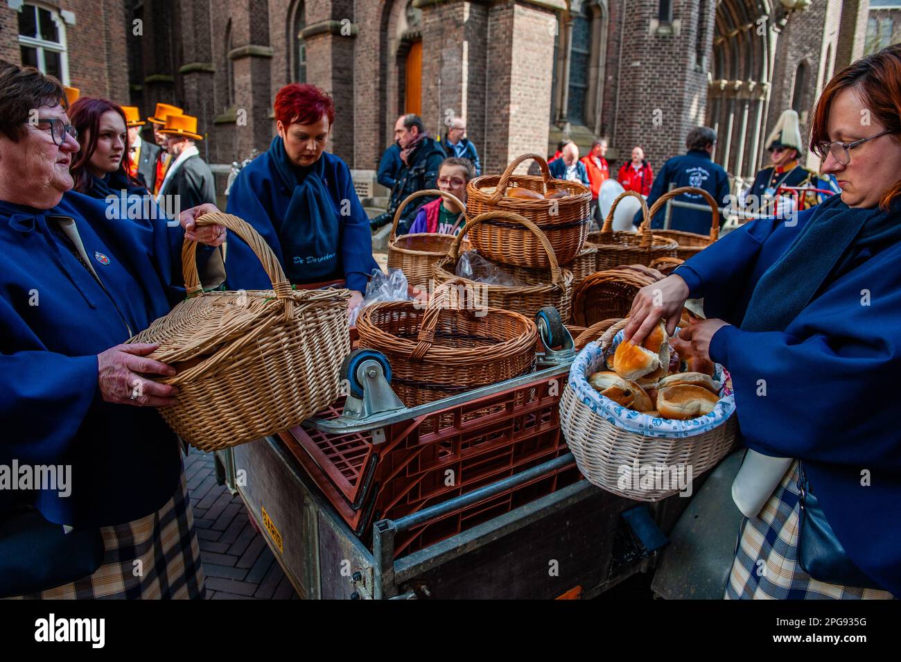 Women are seen taking some of the buns to throw at the people during ...