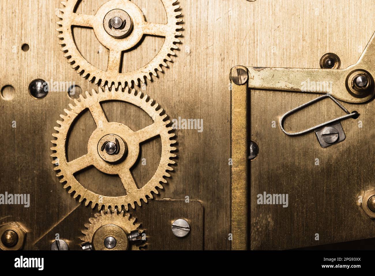 Vintage clock mechanism, close up photo of brass gears with selective ...