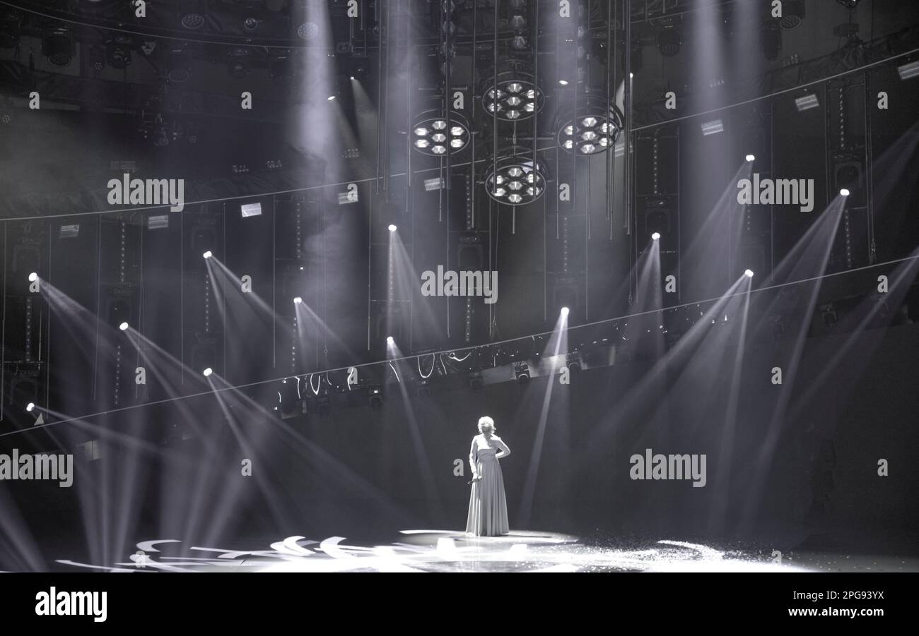 singer on stage at a concert at the microphone Stock Photo - Alamy