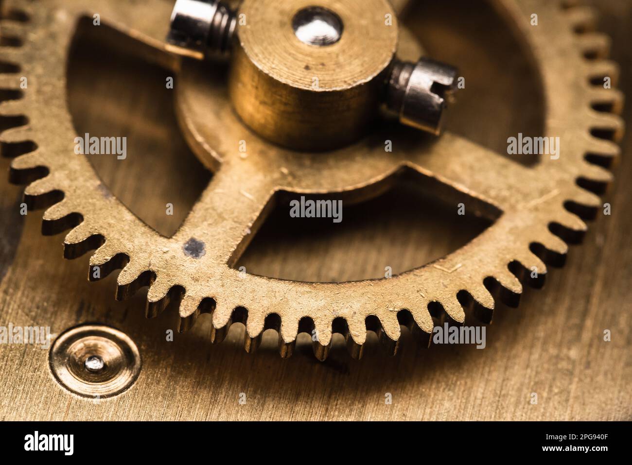 Brass cogwheel of a vintage clock, macro photo with selective soft ...