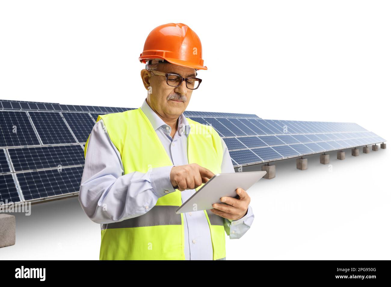 Mature male engineer using a digital tablet at a solar farm isolated on ...
