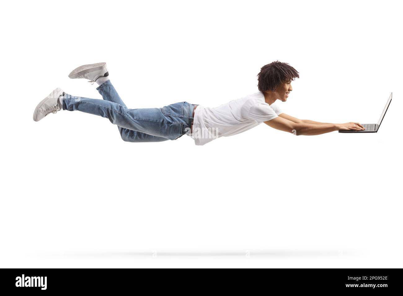 African american young man flying and using a laptop computer isolated ...