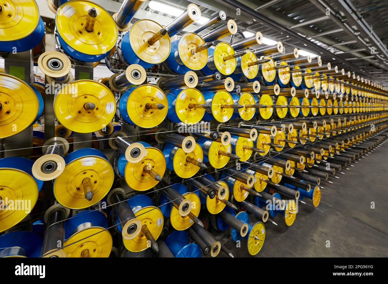 Bobbins coil thin wire to reinforce tires in plant workshop Stock Photo ...