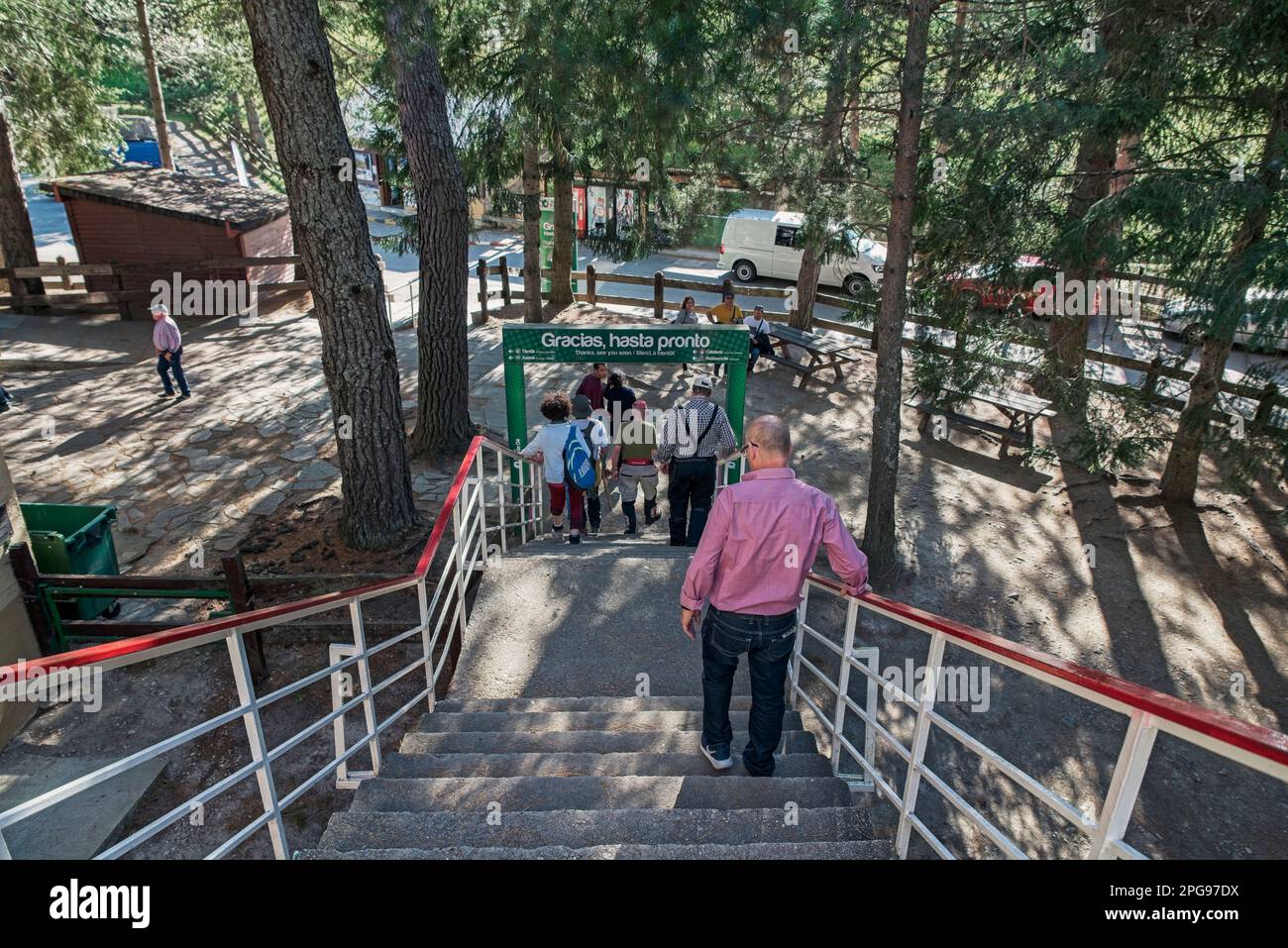 people going outside going down the stairs of the cable car building of ...