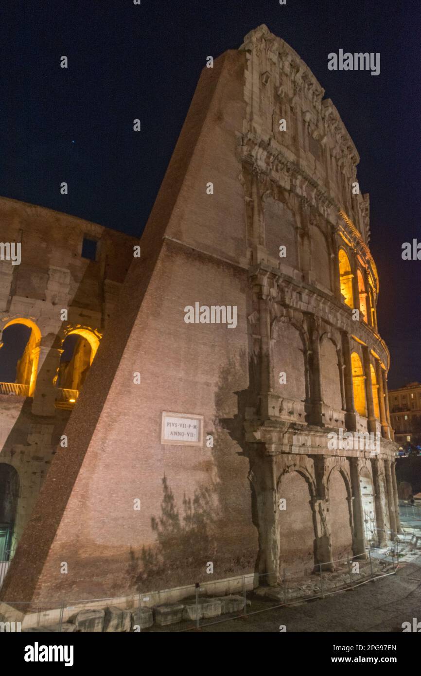 Part of stone walls of the Colosseum at night Stock Photo - Alamy