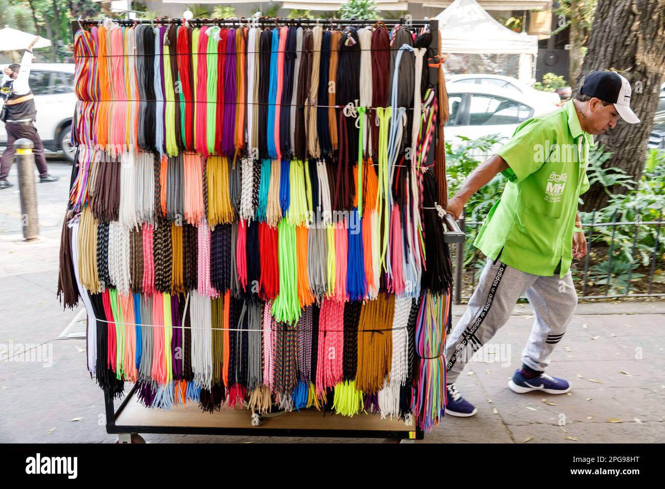 Mexico City,Polanco,pulling rolling cart shoe laces,man men male,adult ...