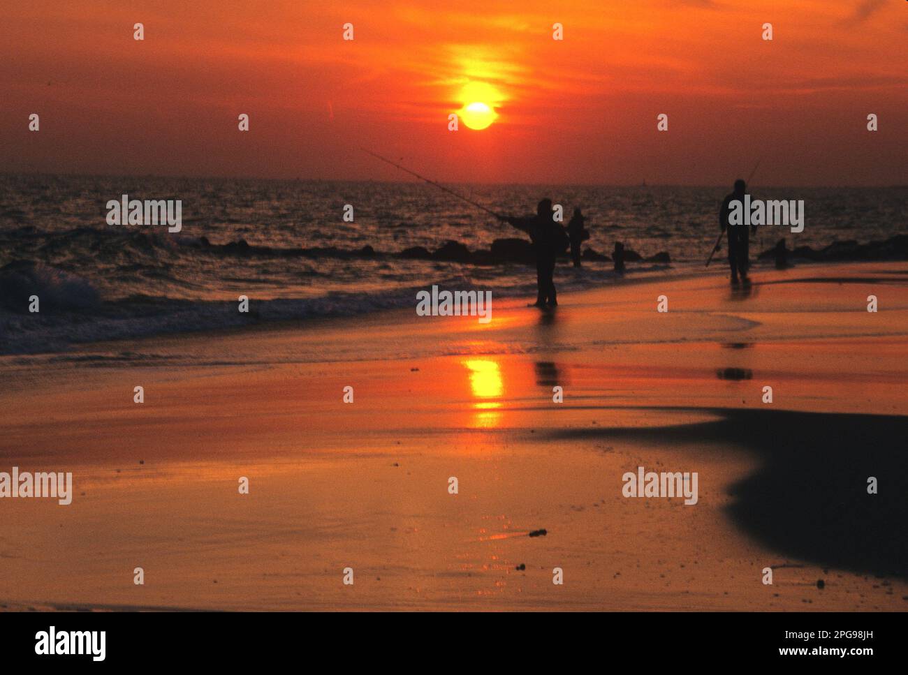 Fishermen at sundown at Fort Tilden Gateway NRA Stock Photo - Alamy