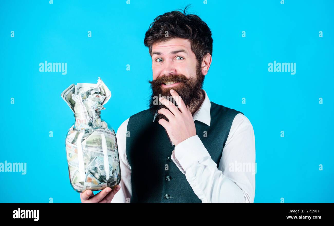 Keeping cash issues. Businessman with his dollar savings. Richness and ...